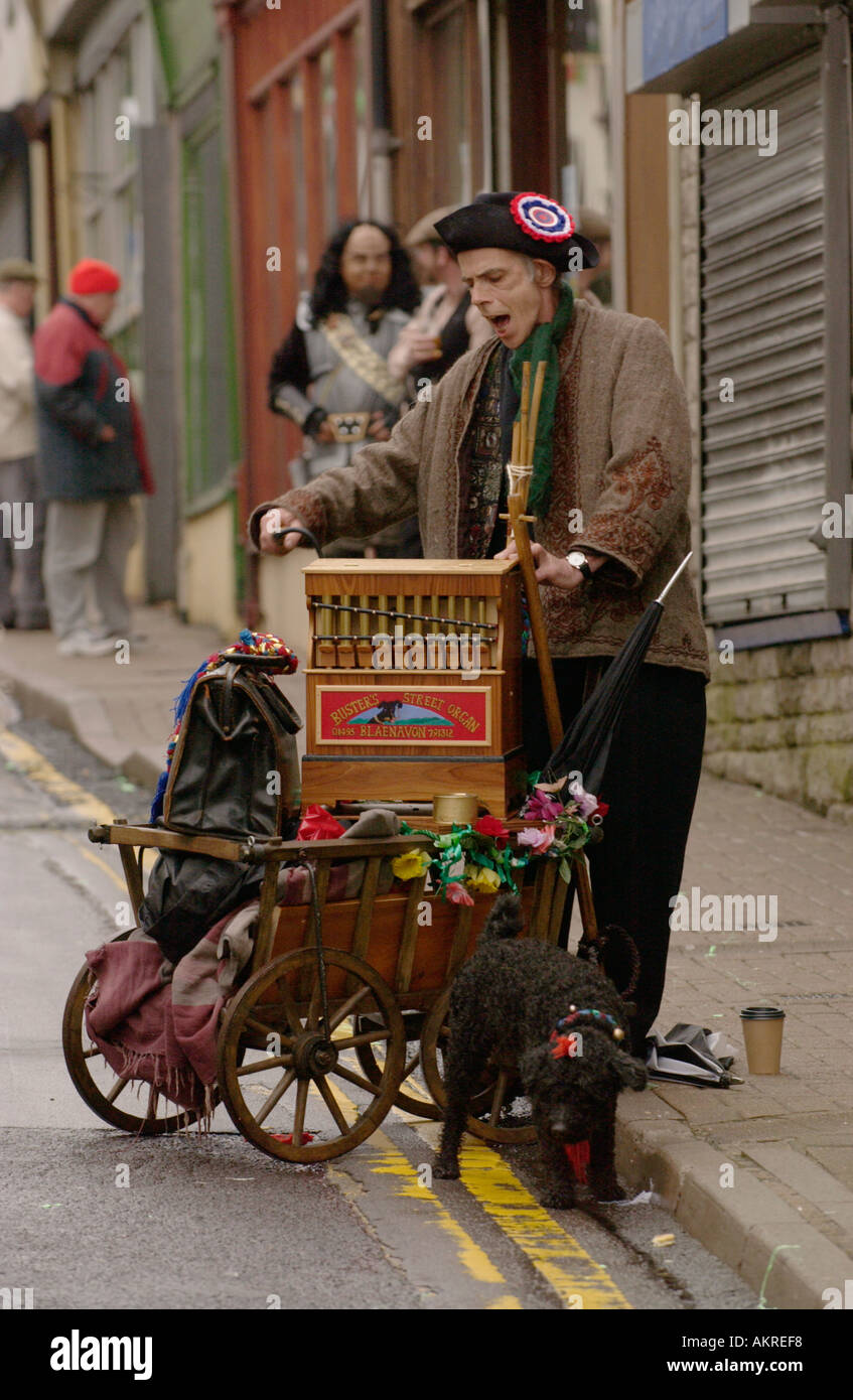 Street entertainer with barrel organ and black dog in Blaenavon Torfaen ...