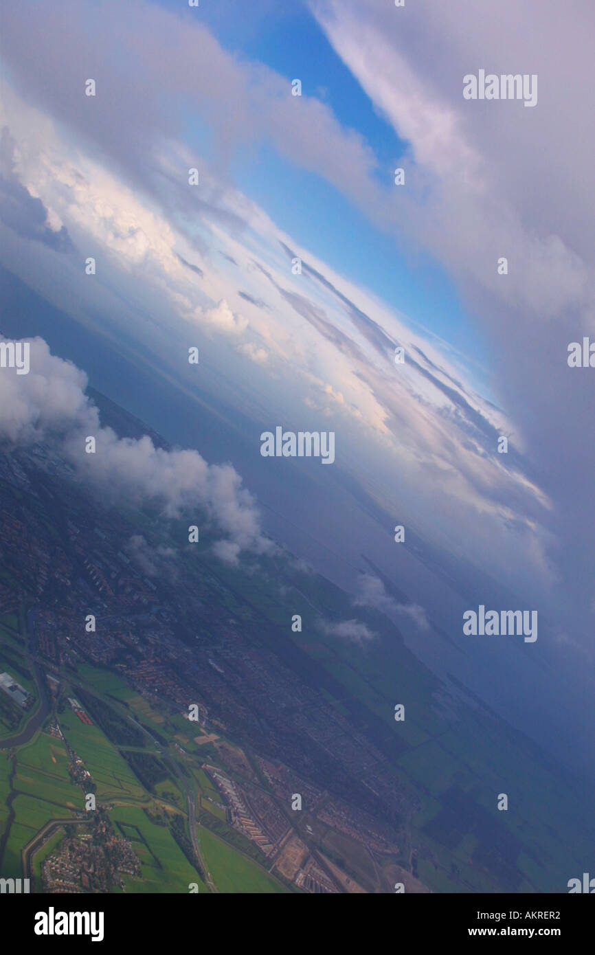 Aerial of earth view with dramatic clouds and blue sky Stock Photo - Alamy