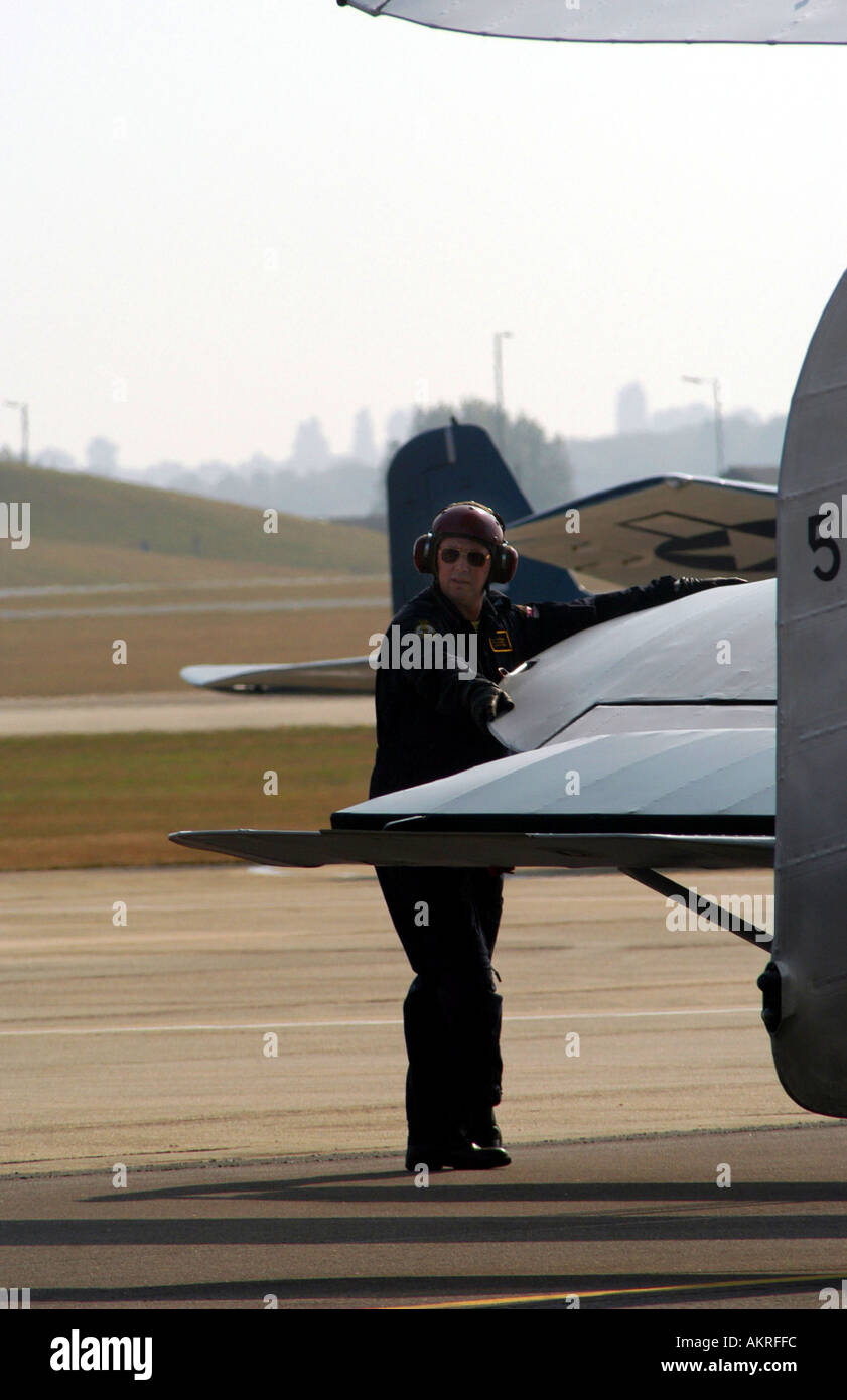 Aircraft handler at a warbirds airshow Stock Photo - Alamy