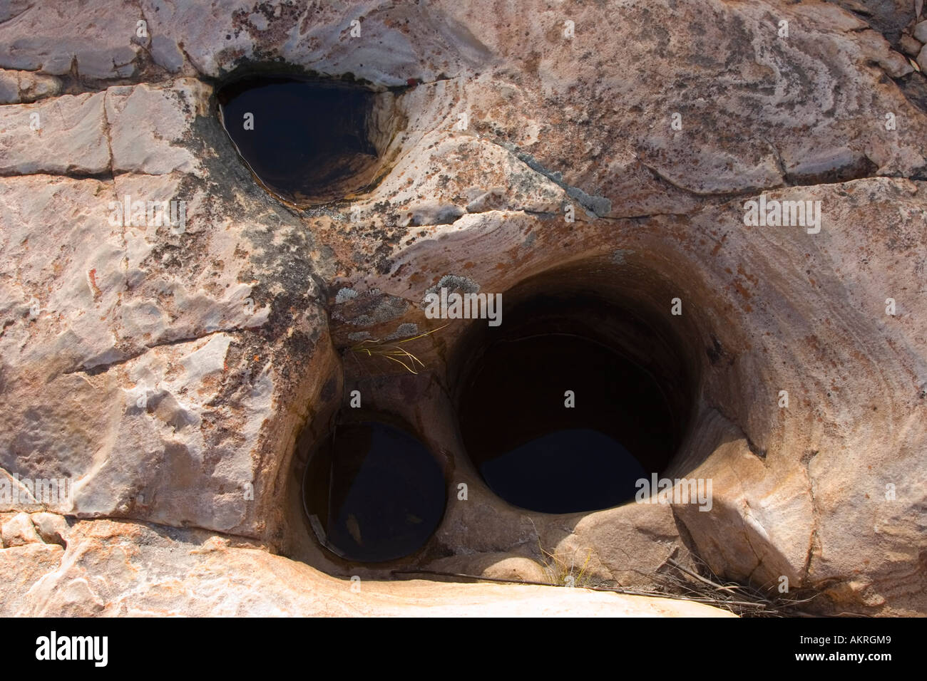 The power of water - holes made in the rocks by smaller rocks that were ...