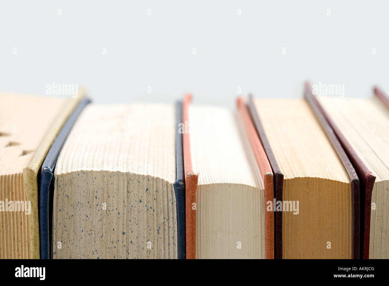 Books in a row Stock Photo - Alamy