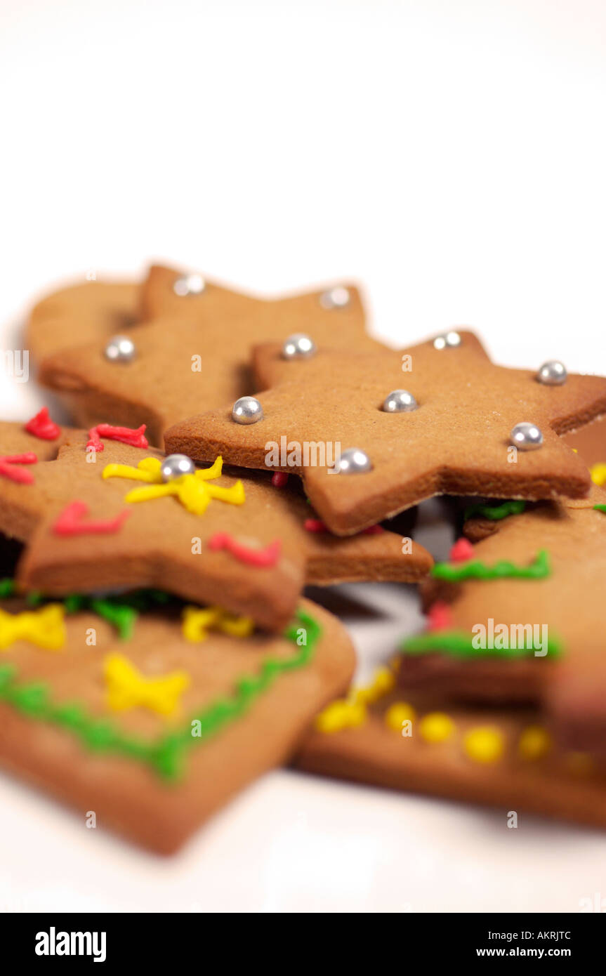 Christmas themed gingerbread biscuits piled on plate Stock Photo - Alamy