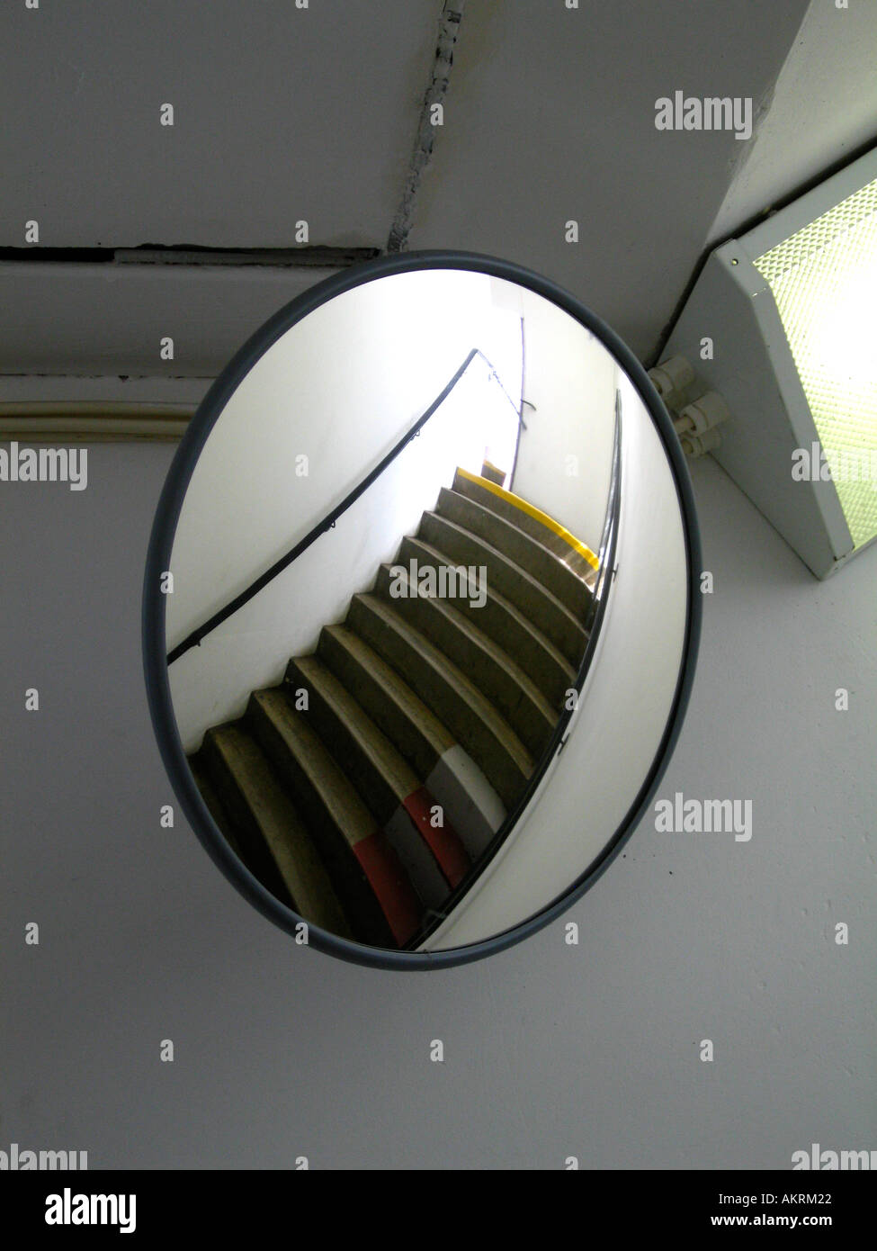 Security observation mirror on stairway Stock Photo - Alamy