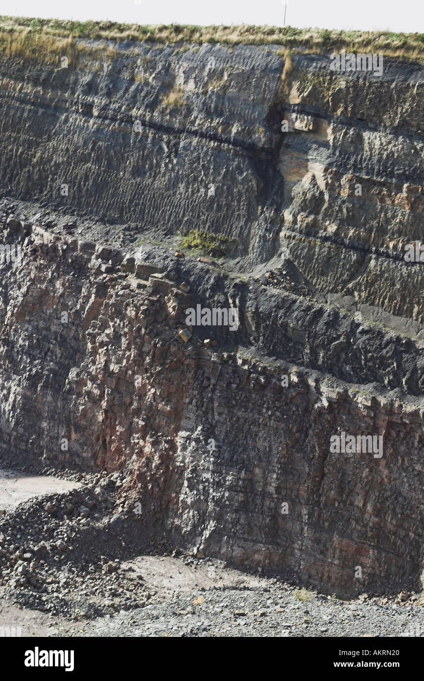 levels and layers of rock in a disused quarry in the lake district ...