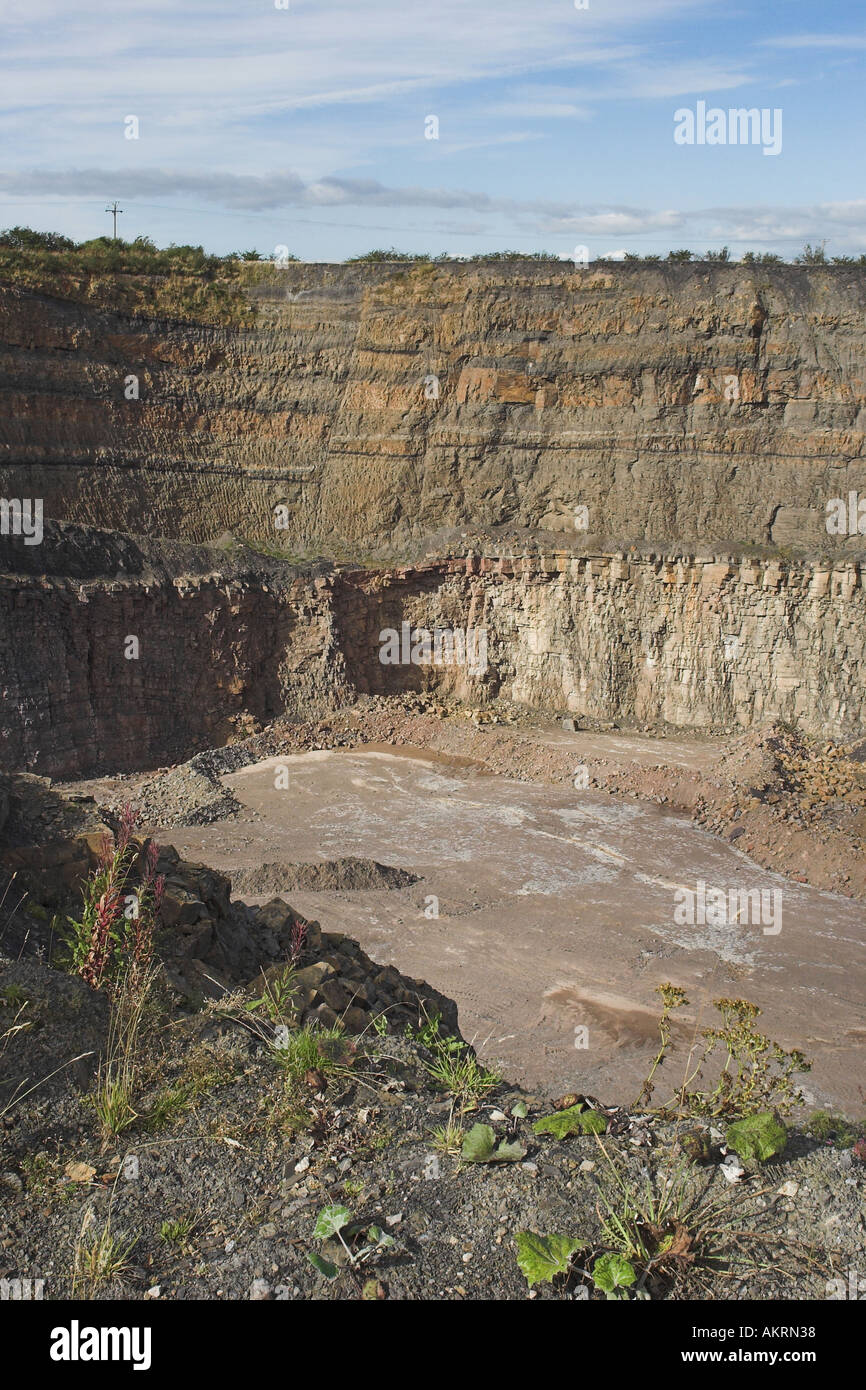 levels and layers of rock in a disused quarry in the lake district ...