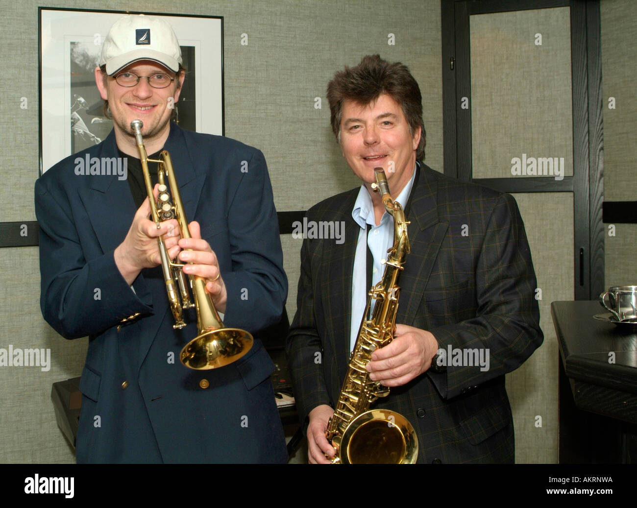 two musicians two men with musical instruments saxsophone and trumpet ...