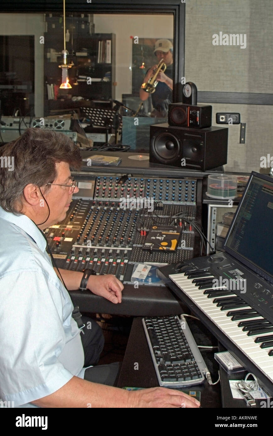 working in recording studio musician audio engineer two men with ...