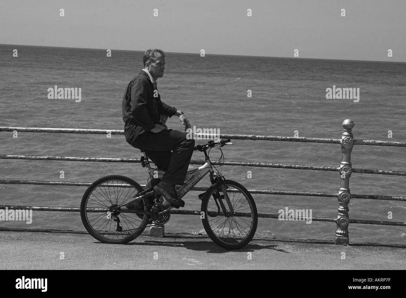 Old man leaning railings Black and White Stock Photos & Images - Alamy