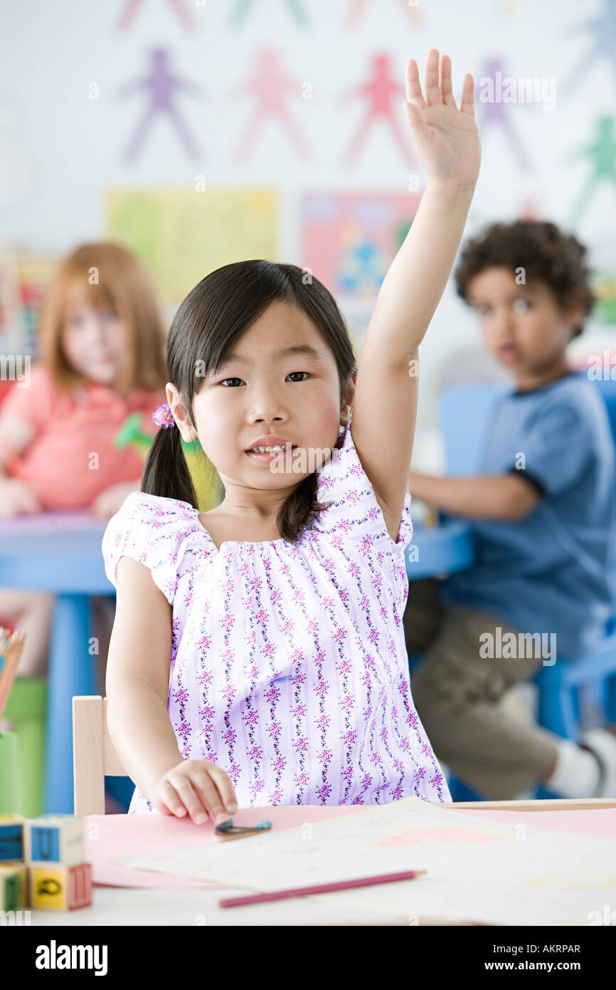 Girl raising arm Stock Photo - Alamy
