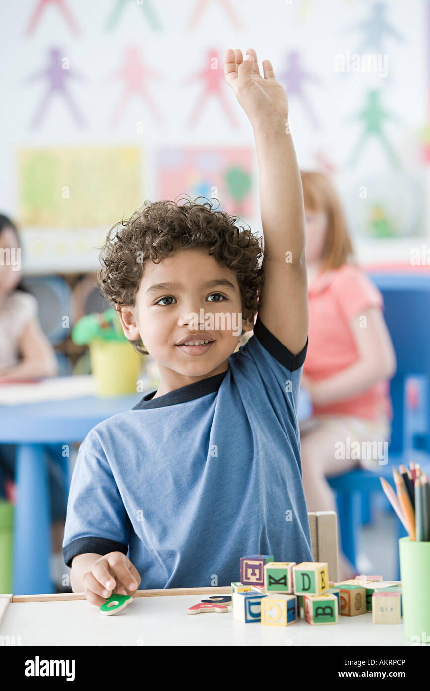 Boy raising arm Stock Photo - Alamy