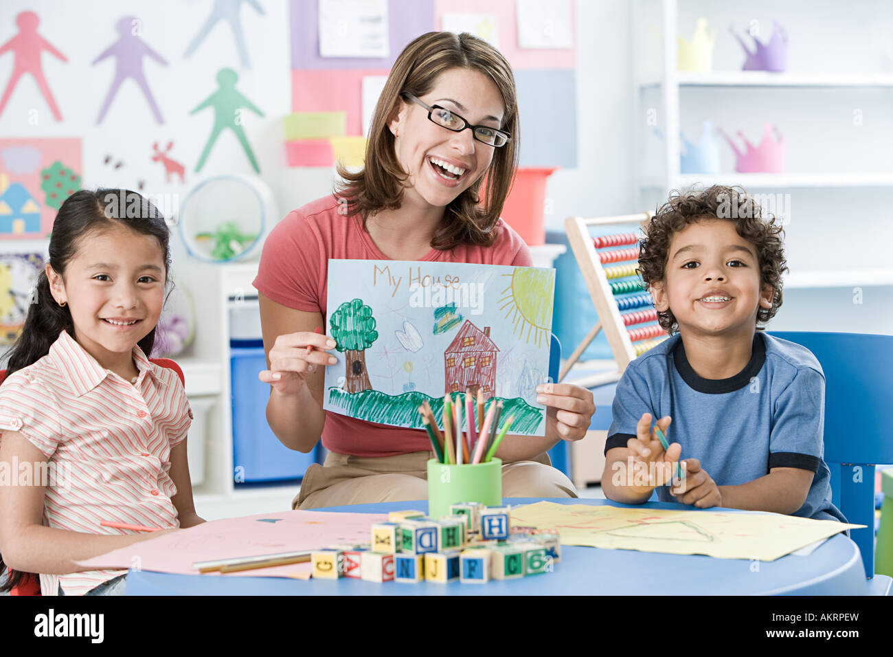 Female school teacher holding traditional hi-res stock photography and ...