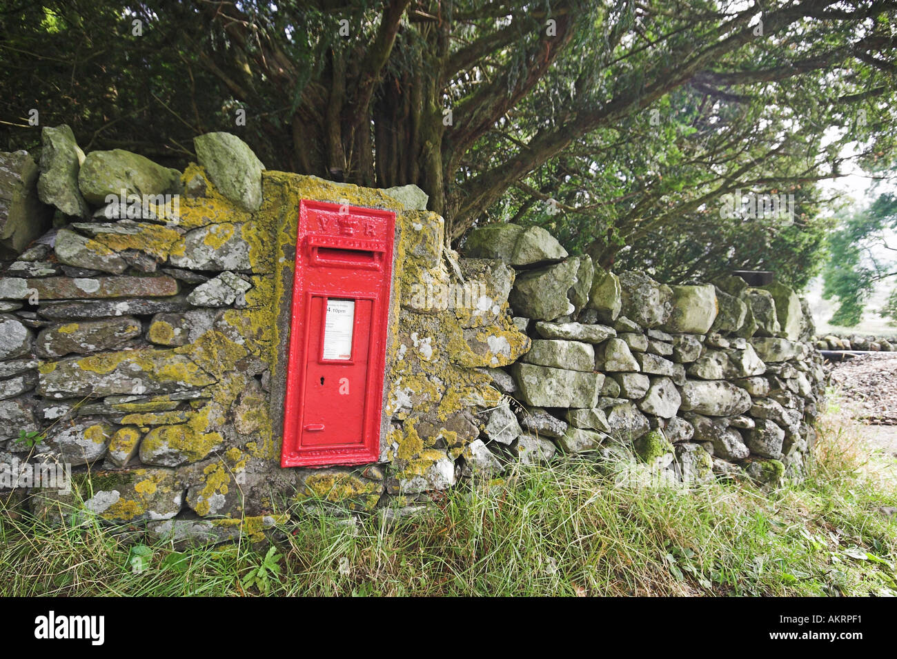 post box placed in a traditional wall in a rural part of cumbria, uk ...