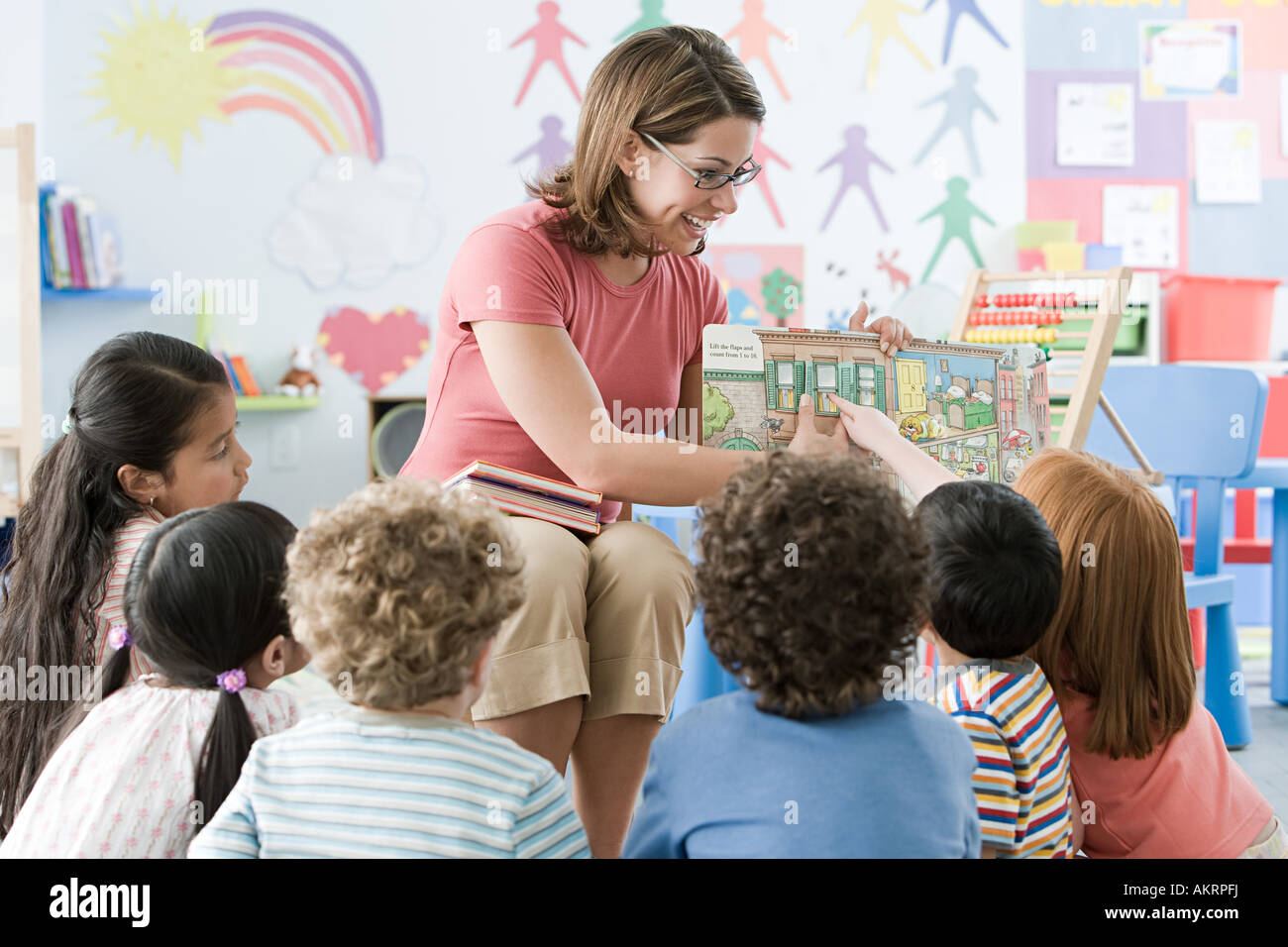 A teacher with children Stock Photo - Alamy