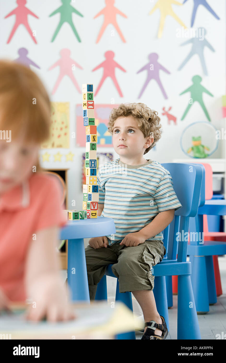 Boy playing with building blocks Stock Photo - Alamy