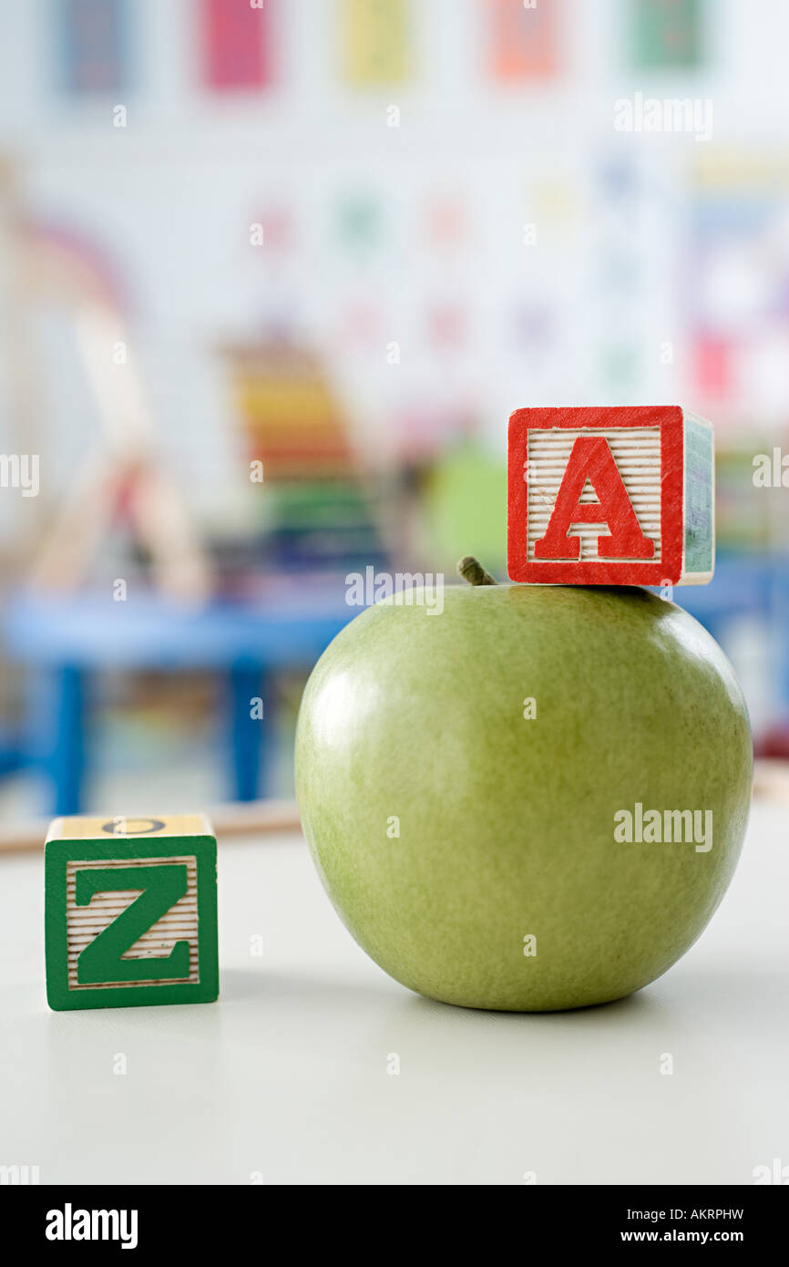 Apple and building blocks Stock Photo - Alamy