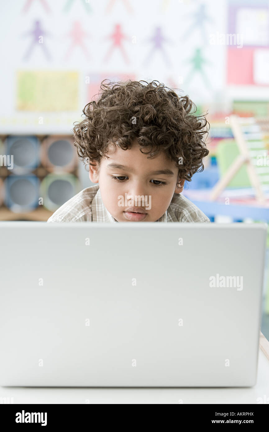 Boy using laptop Stock Photo - Alamy