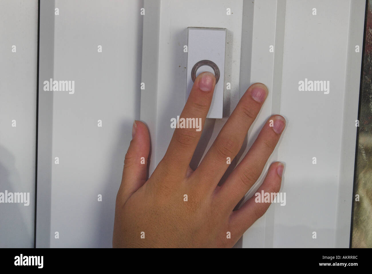 Woman ringing doorbell hi-res stock photography and images - Alamy