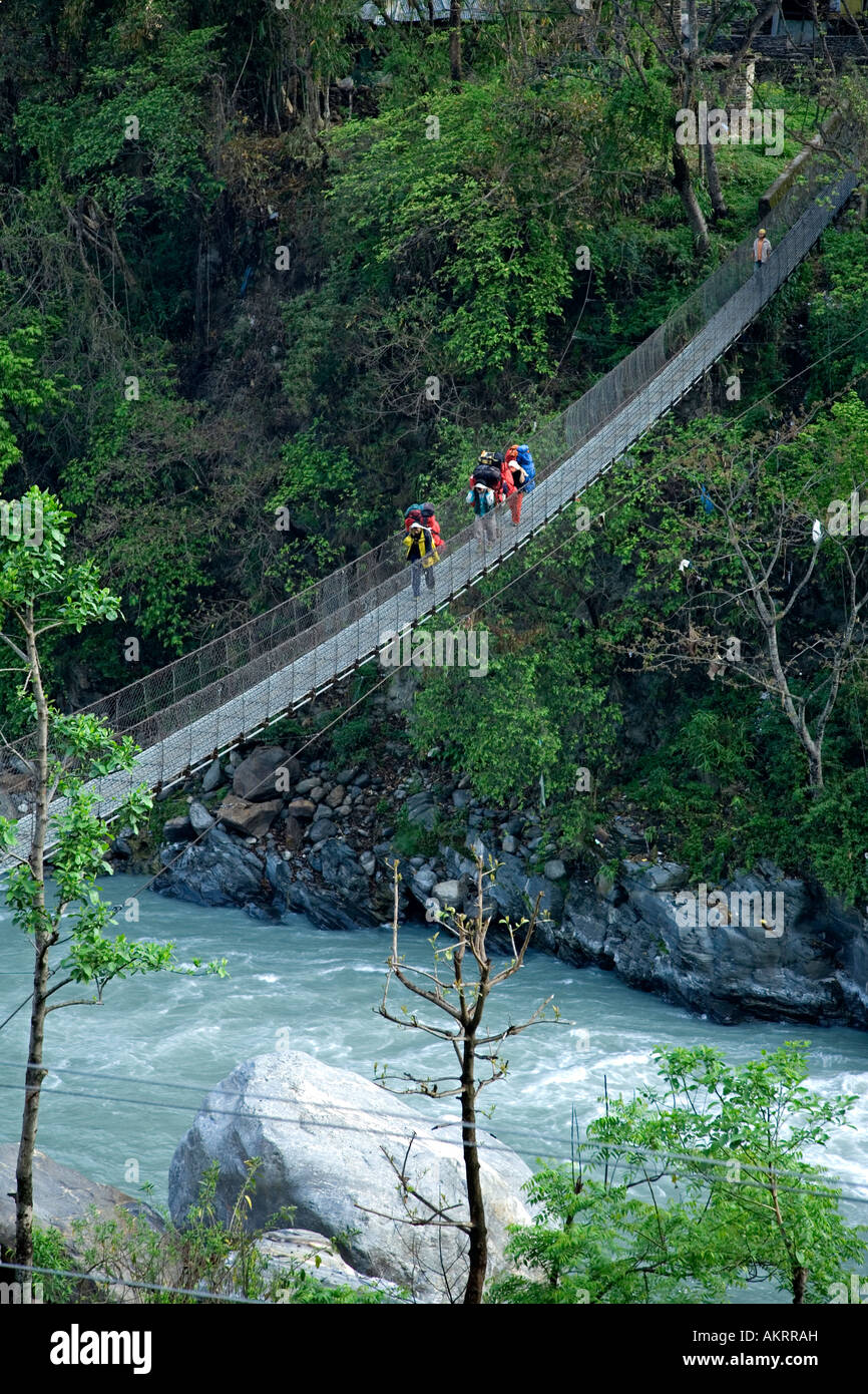 Crossing a bridge. Bhulbhule village. Annapurna circuit trek. Nepal ...