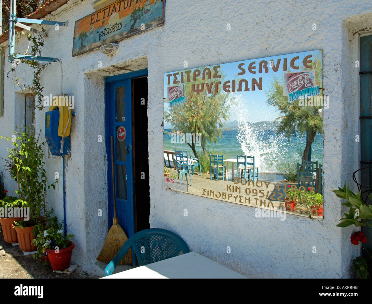 greek kafenion bar restaurant with a mirror on the wall reflecting the ...