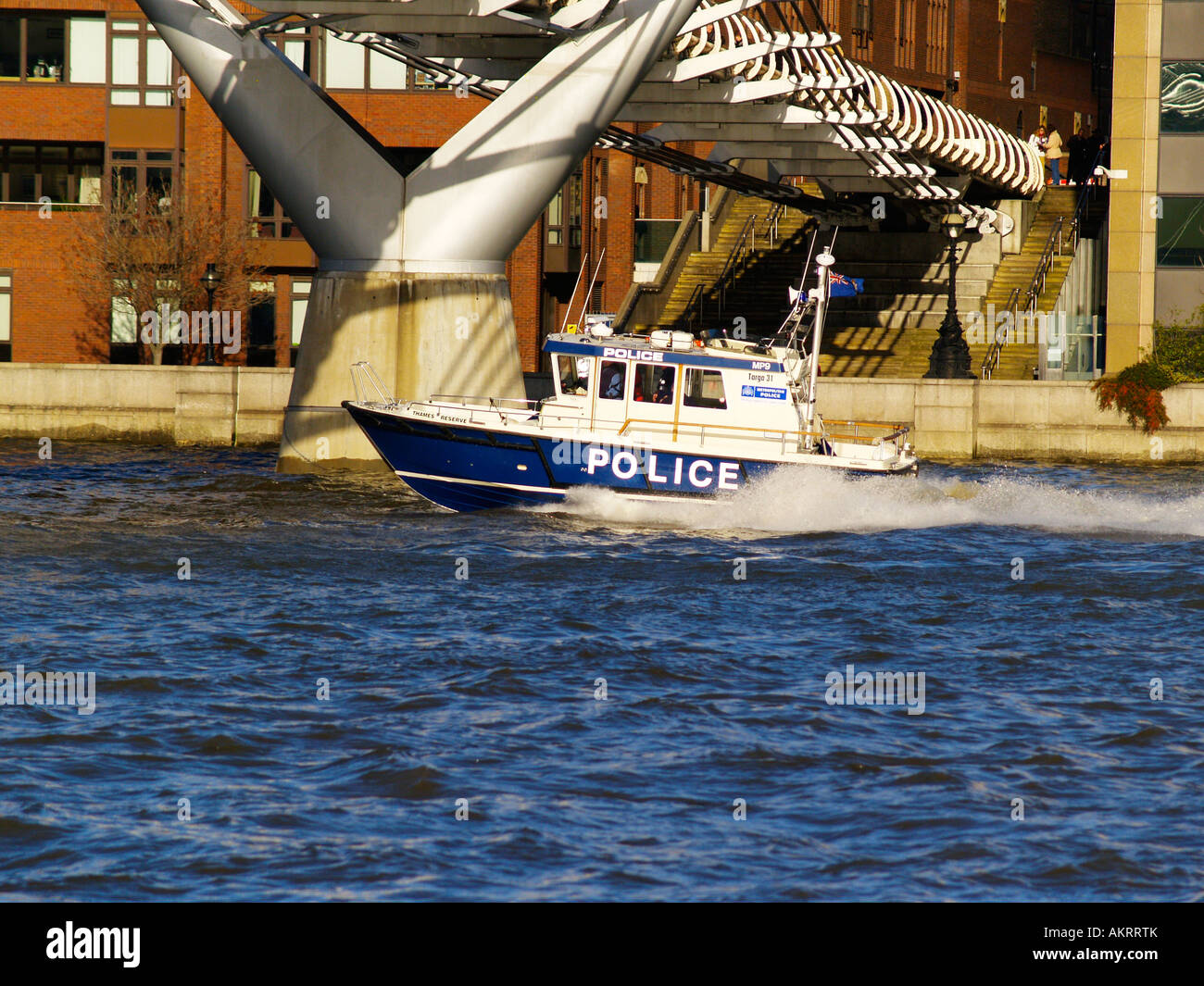 Police Launch speeding on the Thames Stock Photo - Alamy