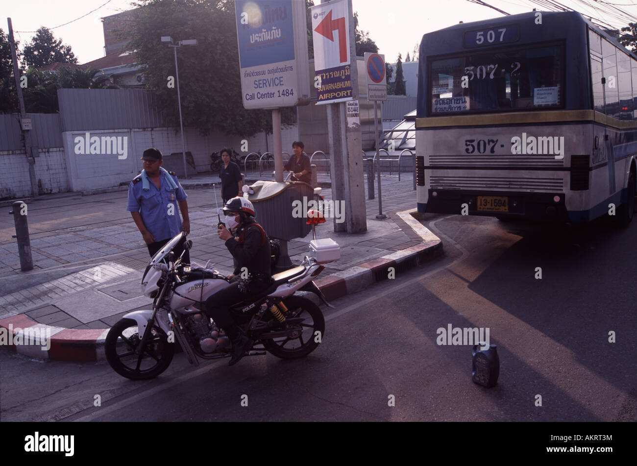 Thai policeman and a bus driver on street bangkok Stock Photo - Alamy