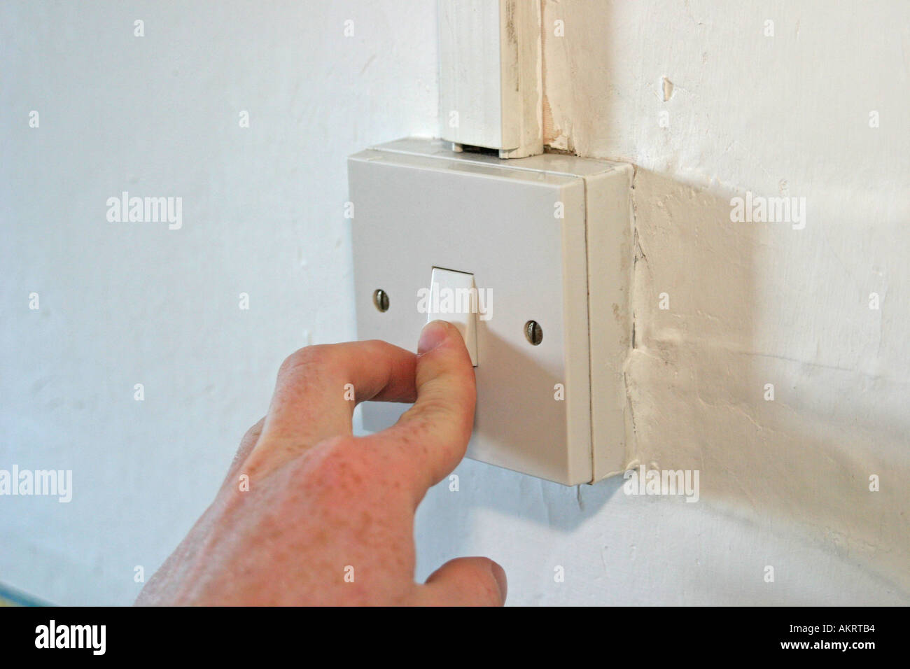 Hand turning out light switch hi-res stock photography and images - Alamy
