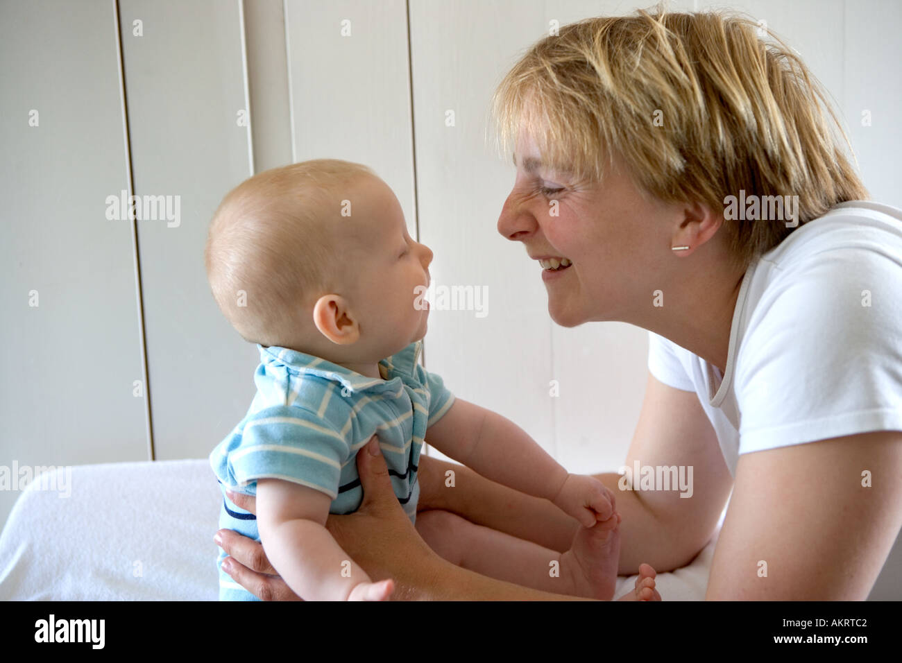 Mother and baby communicating Stock Photo - Alamy