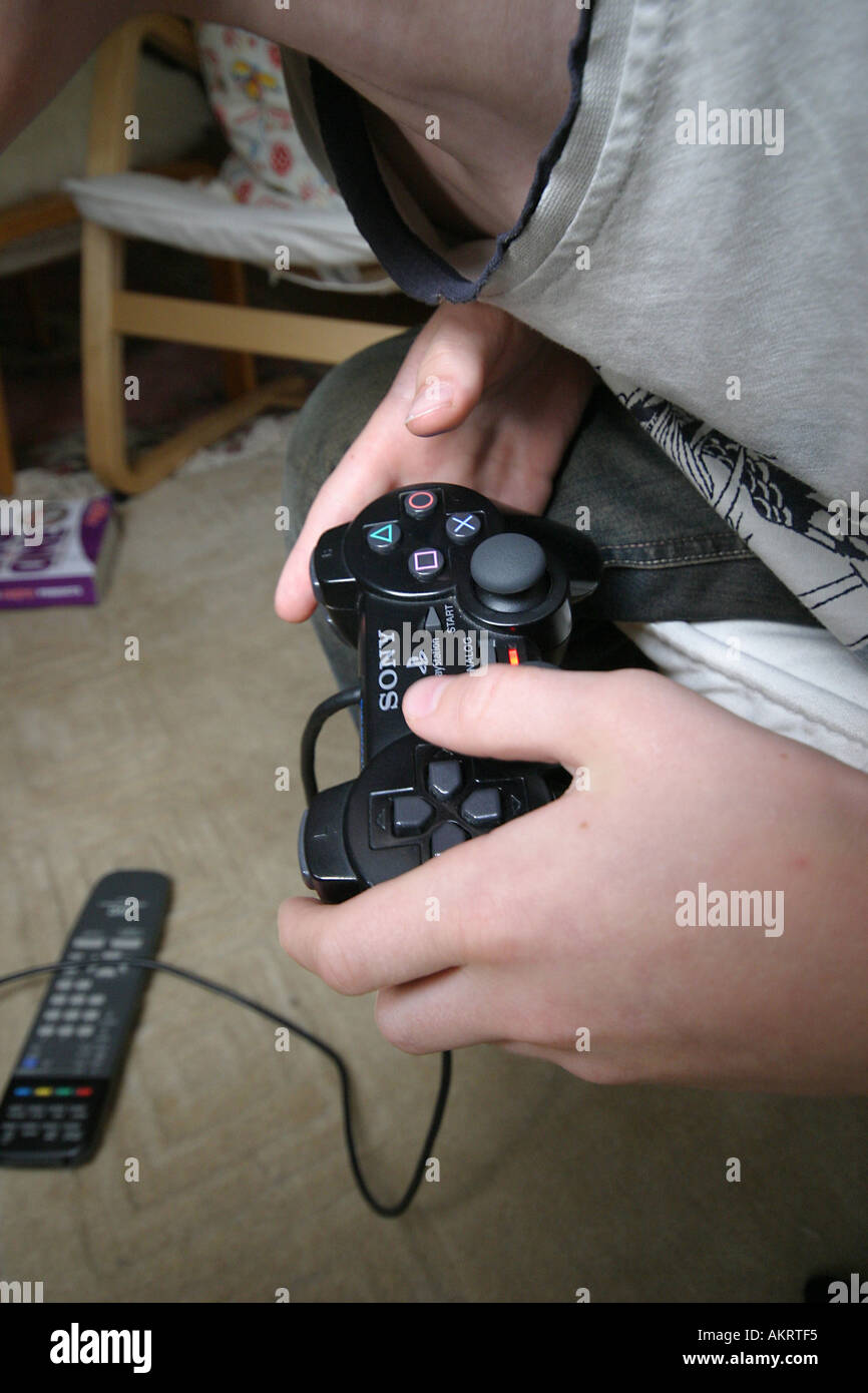 boy holding a playstation controller Stock Photo - Alamy