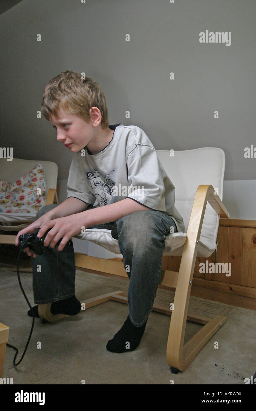 boy playing on a computer game Stock Photo - Alamy
