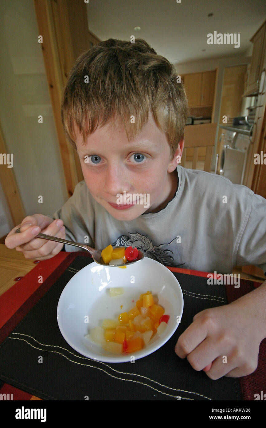Boy eating fruit teeth hi-res stock photography and images - Alamy