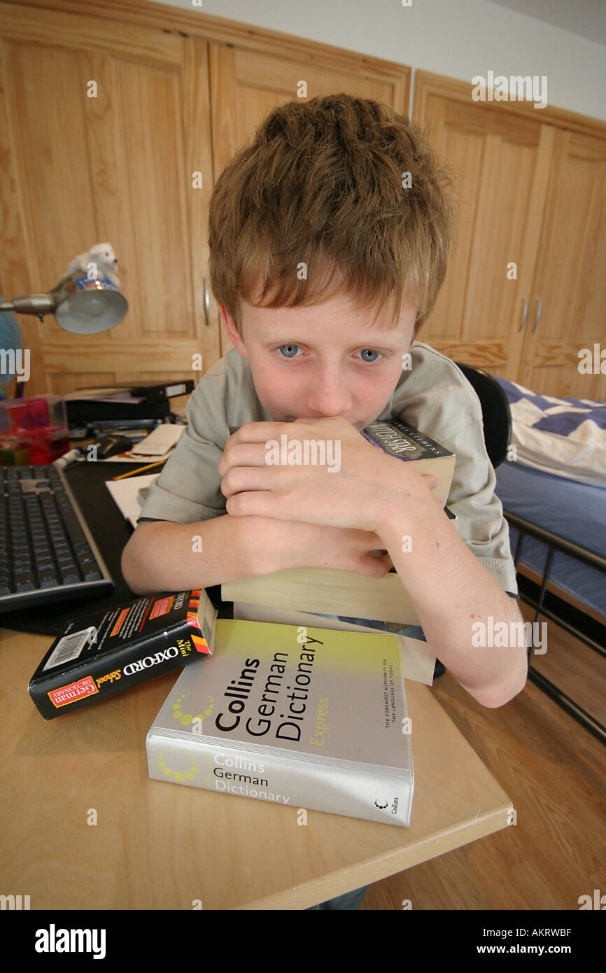 boy bored whilst meant to be studying Stock Photo - Alamy