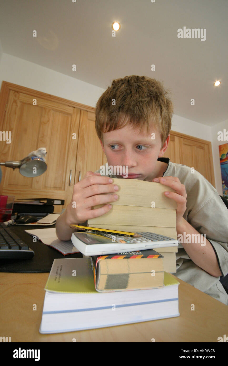 boy bored whilst meant to be studying Stock Photo - Alamy