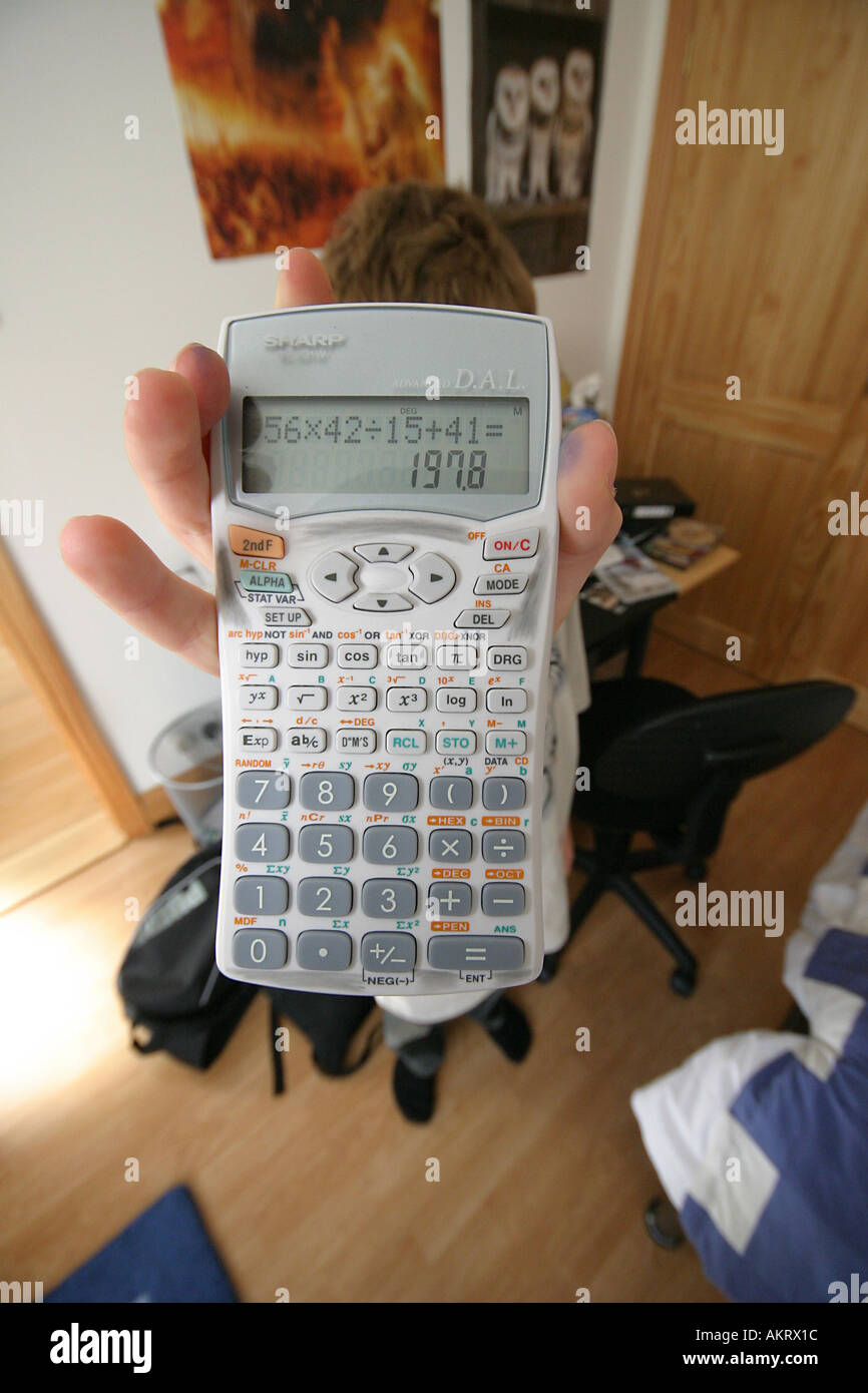 boy using a calculator Stock Photo - Alamy