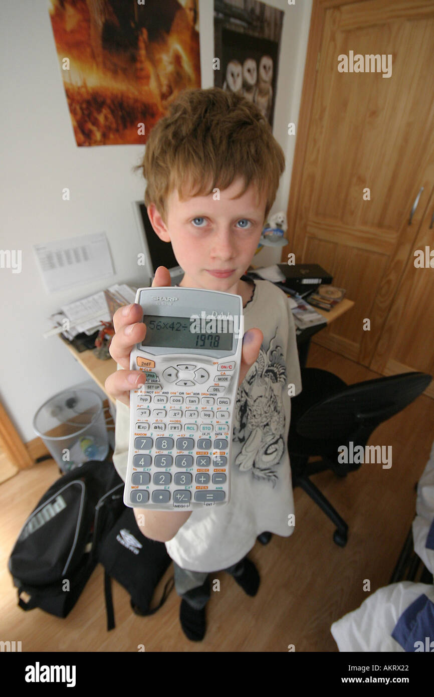 boy using a calculator Stock Photo - Alamy
