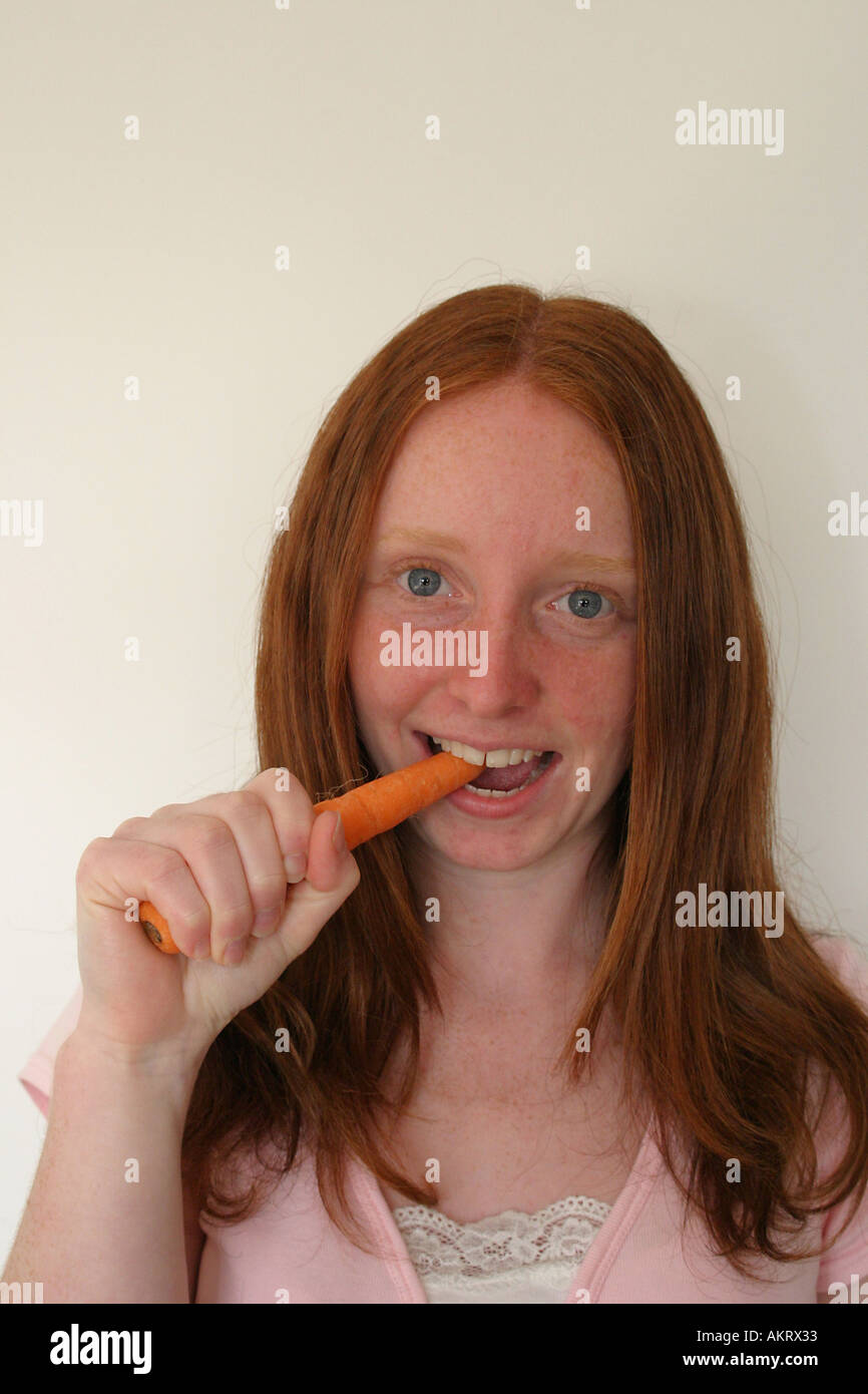 Teenager girl eating carrot hi-res stock photography and images - Alamy