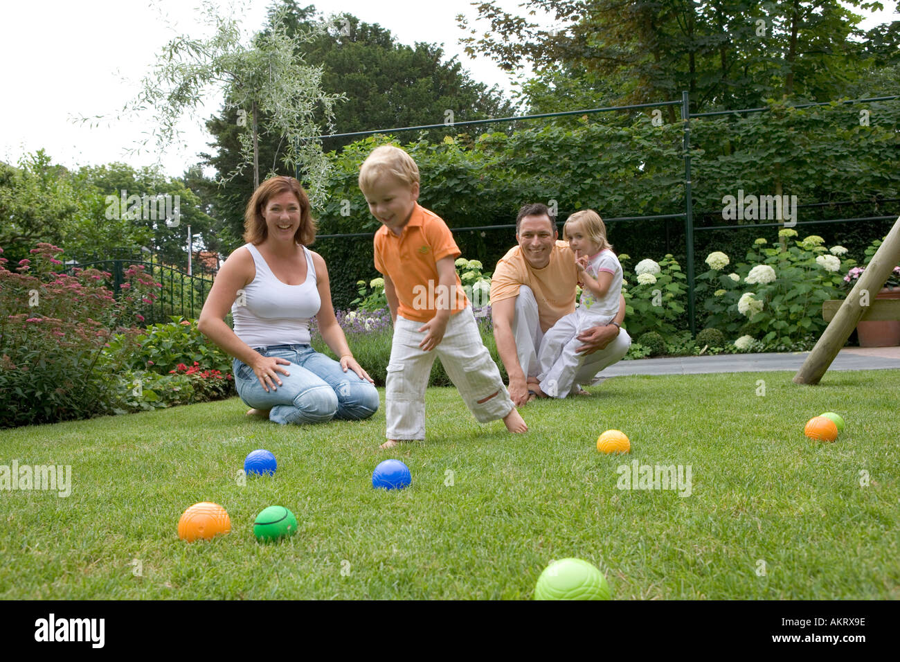 Family playing a game together Stock Photo - Alamy