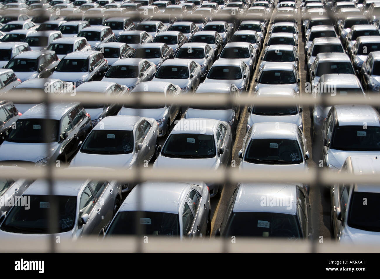 cars behind bars view of customs area with new imported cars Stock ...