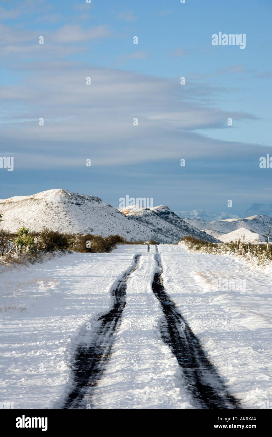 Rural road in the Chihuahuan Desert under snow near Marathon west Texas ...