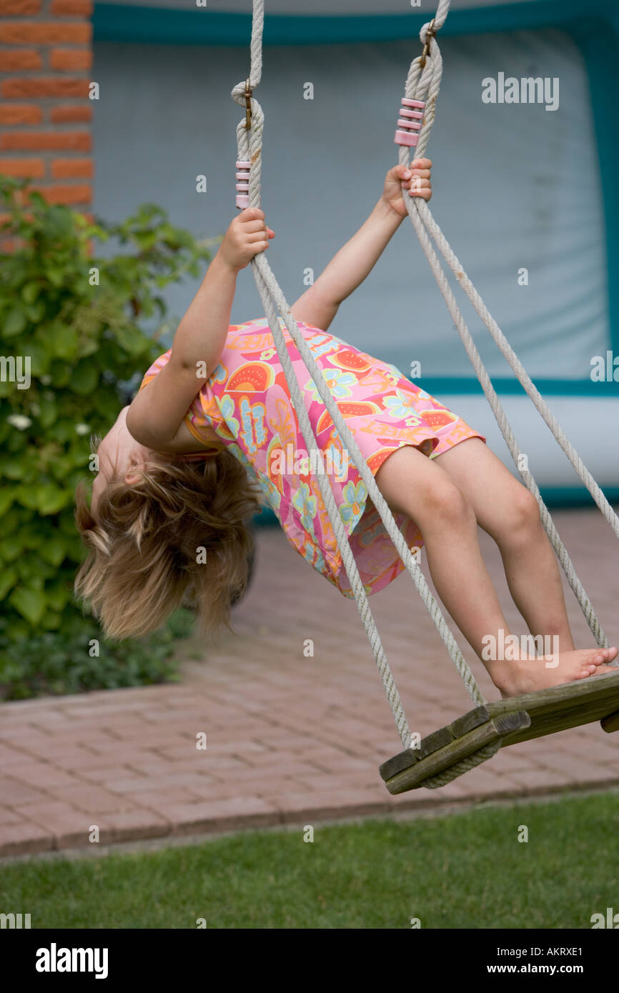Girl on a swing Stock Photo - Alamy
