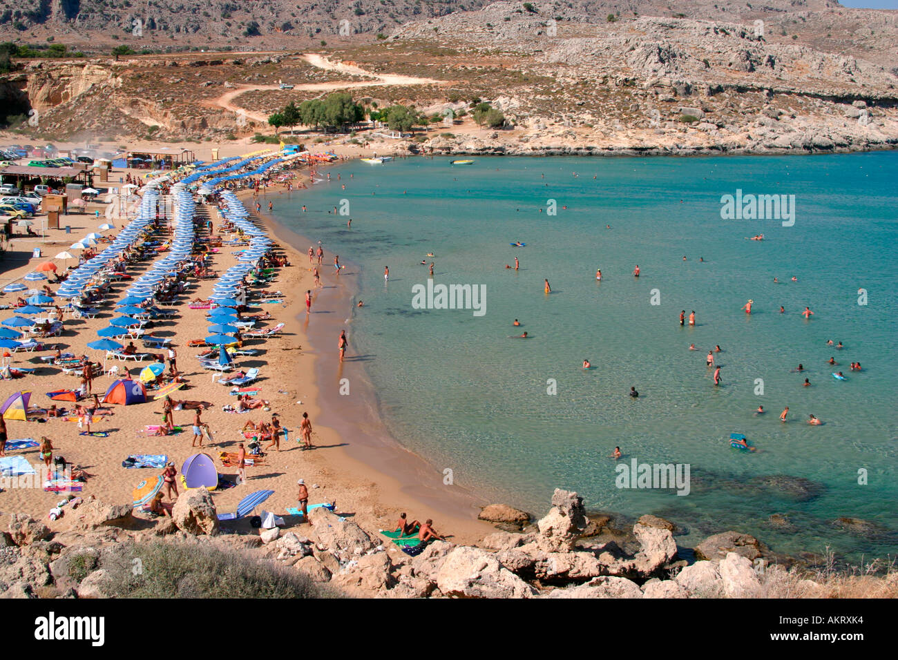The pattern of the beach umbrella in the golden beach, Haraki, Rhodes ...