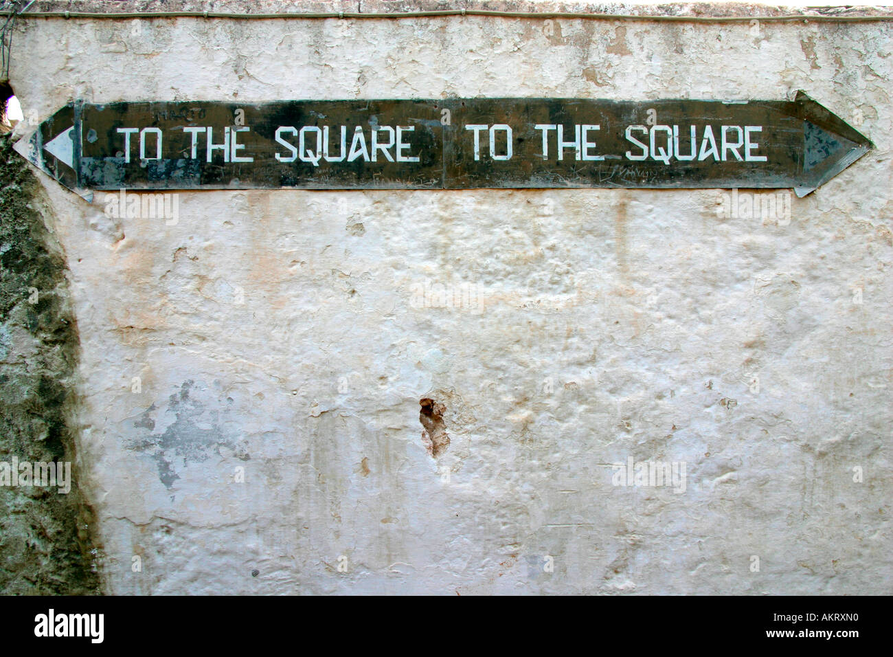 A signpost indicating opposite directions to the square, Lindos, Rhodes ...