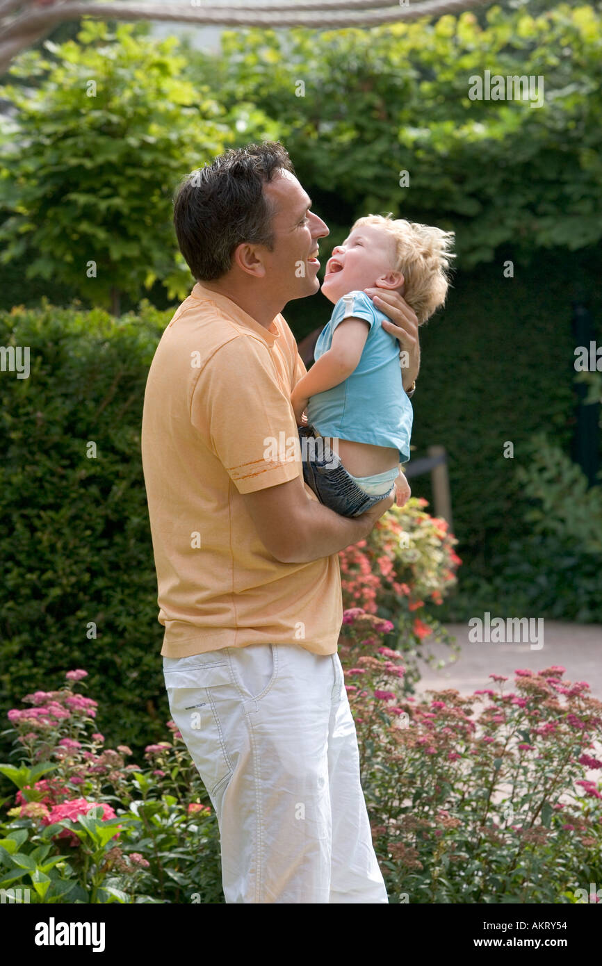 Father and son romping Stock Photo - Alamy