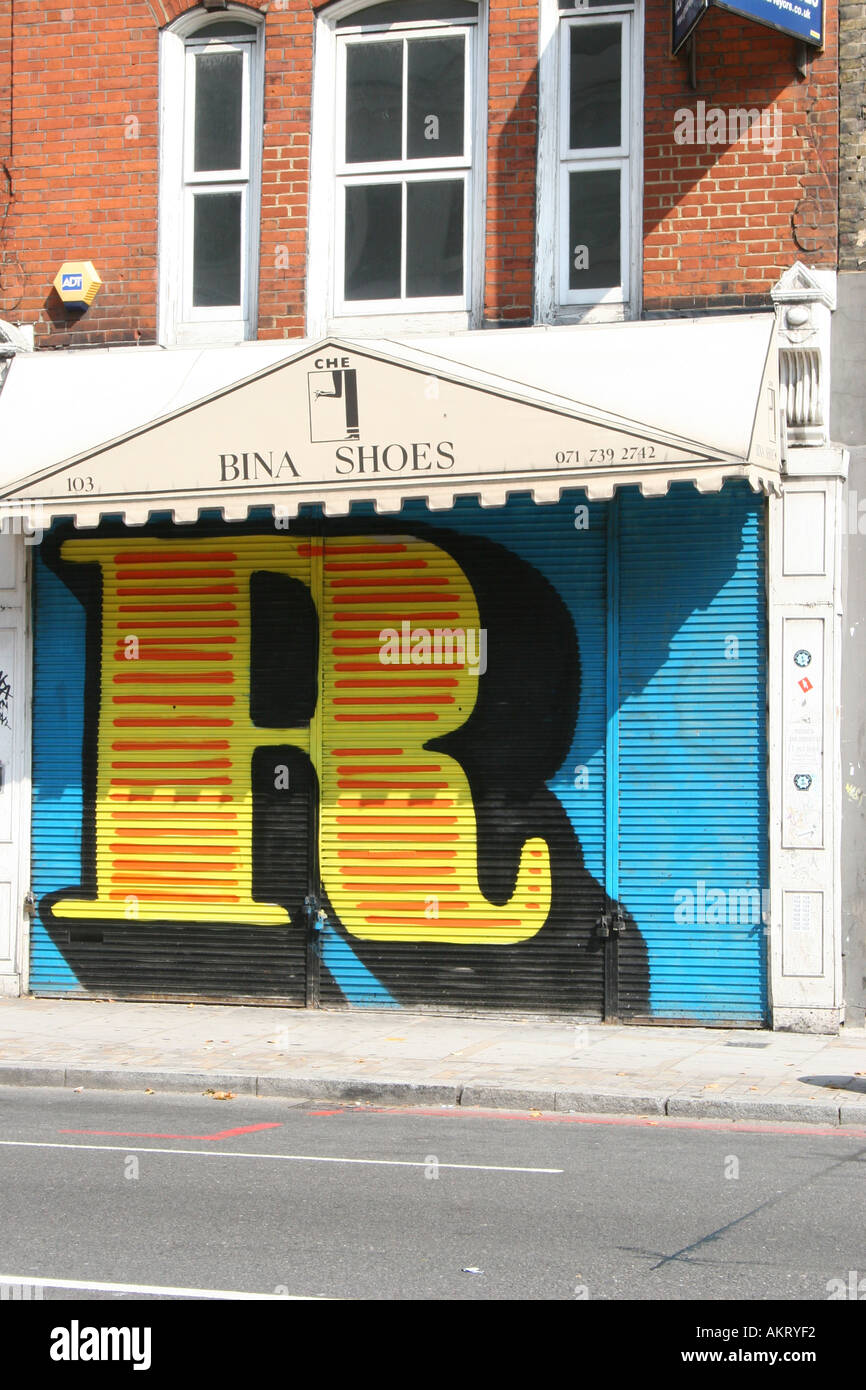 Painted shutter on shoe shop Stock Photo - Alamy