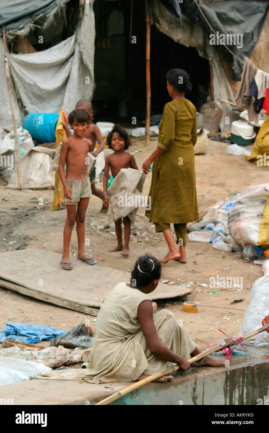 Poor condition of children living among garbage in a large camp, India ...