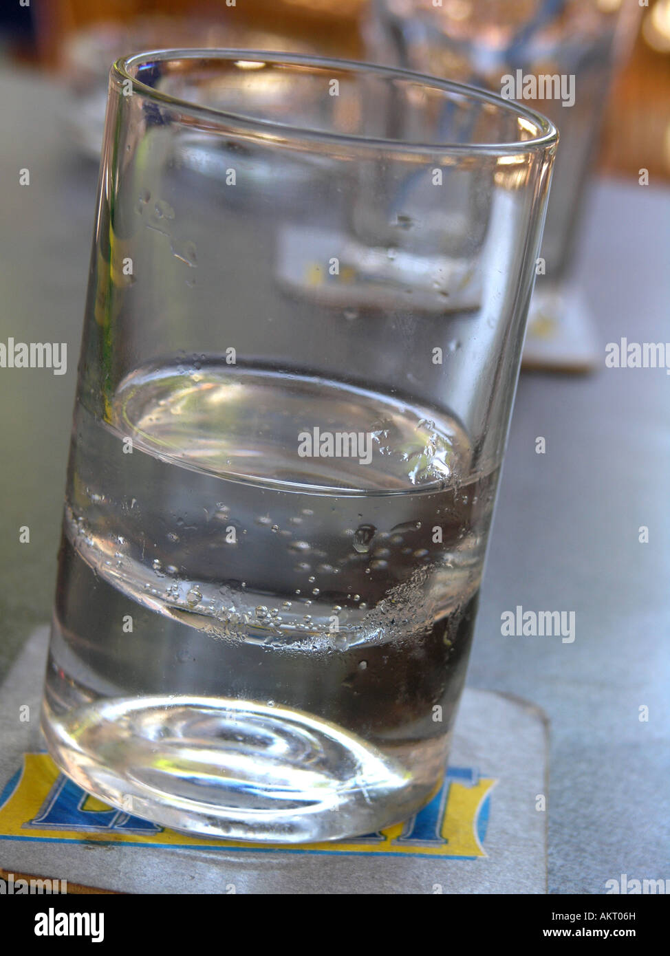 Glass of Water on a table Stock Photo - Alamy
