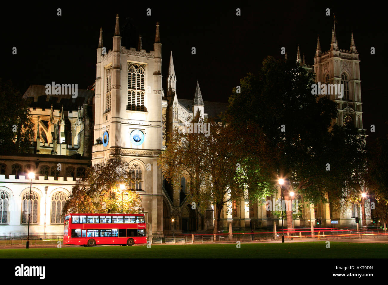 westminster abbey at night lit illuminated red bus passing westminster ...