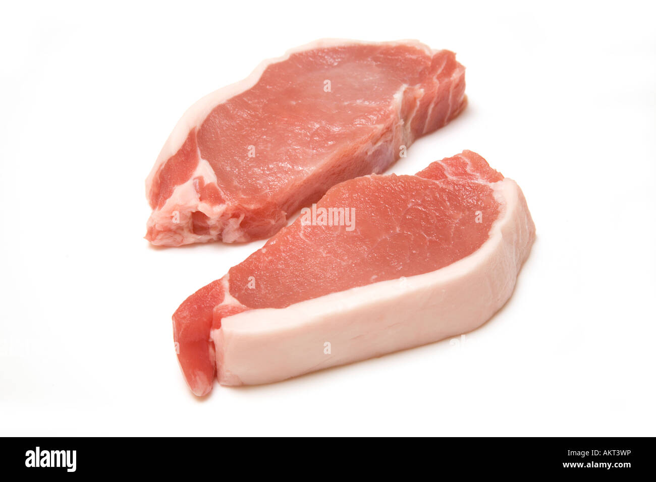 Pork lion chops isolated on a white studio background Stock Photo - Alamy