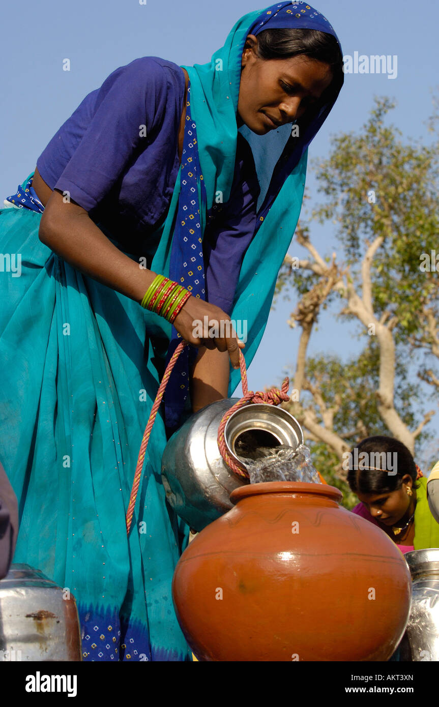 Hindu Woman collecting water from a well in a village near Bharatpur ...
