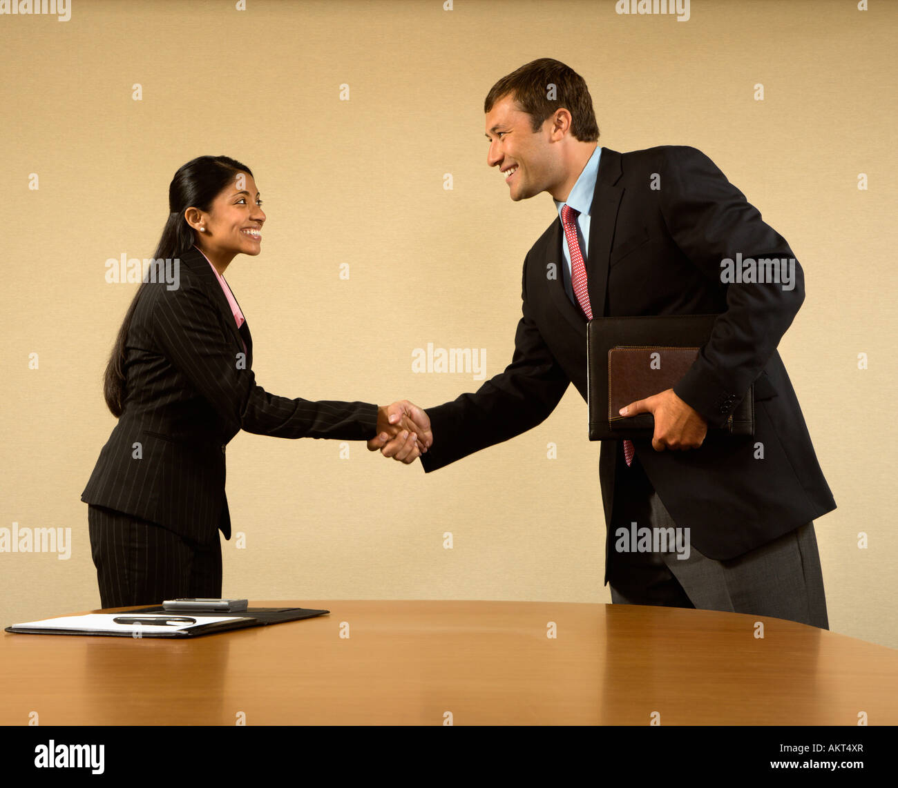 Half length smiling profile handshake shaking hands hi-res stock ...