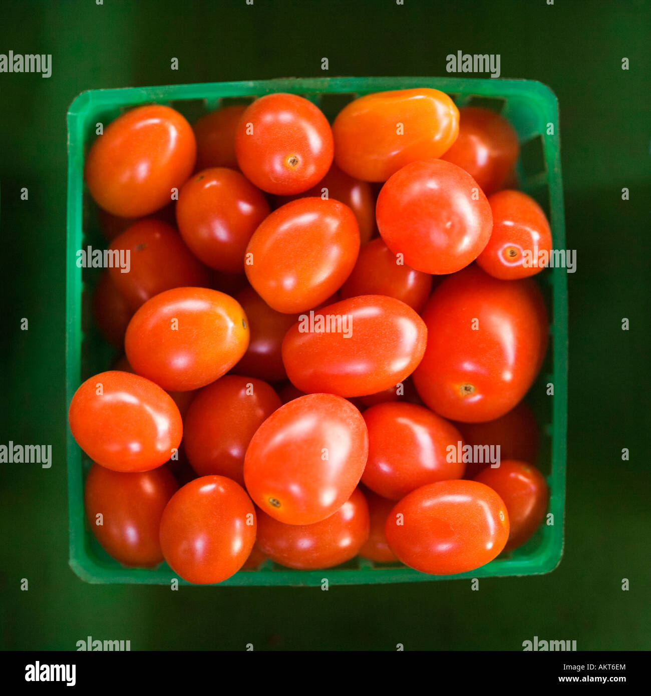 Container of red cherry tomatoes Stock Photo - Alamy